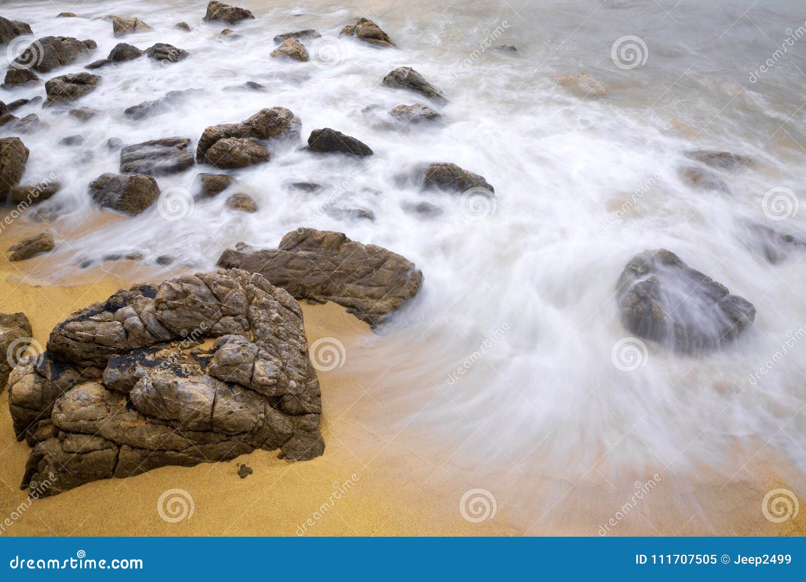 Water waves and the rocks stock image. Image of nature - 111707505