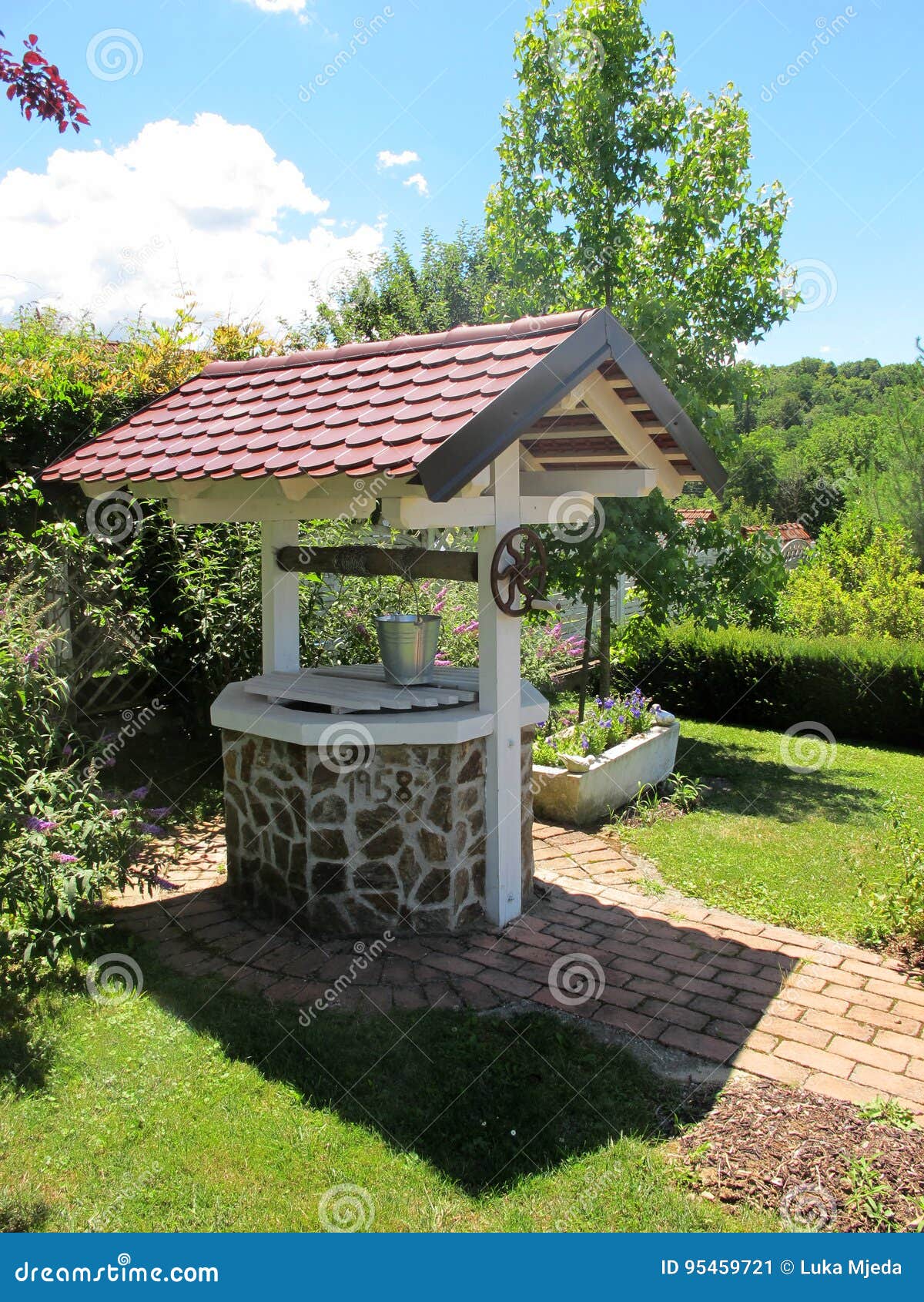 WATER WELL in a GARDEN stock image. Image of stone, nature - 95459721