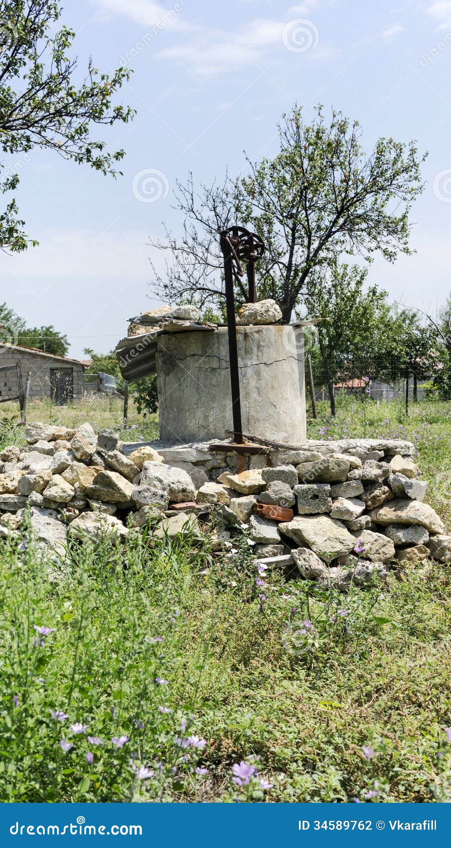 Water well made of stones stock photo. Image of green - 34589762