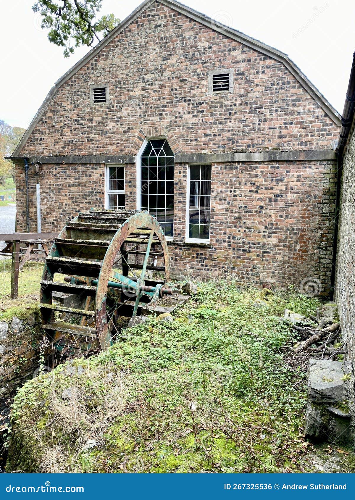 Water Wheel at the Side of Brick Building. Carradale, Scotland. Stock ...