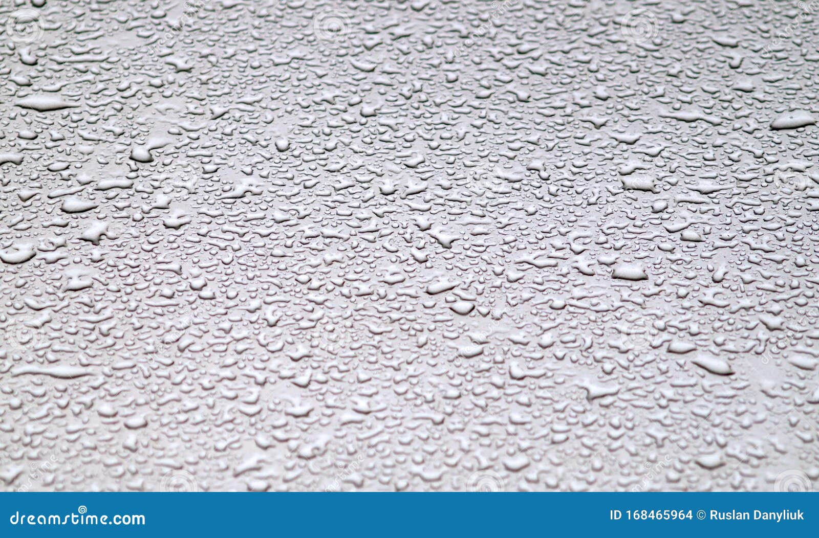 Waterdrops on grey surface stock photo. Image of backdrop - 168465964