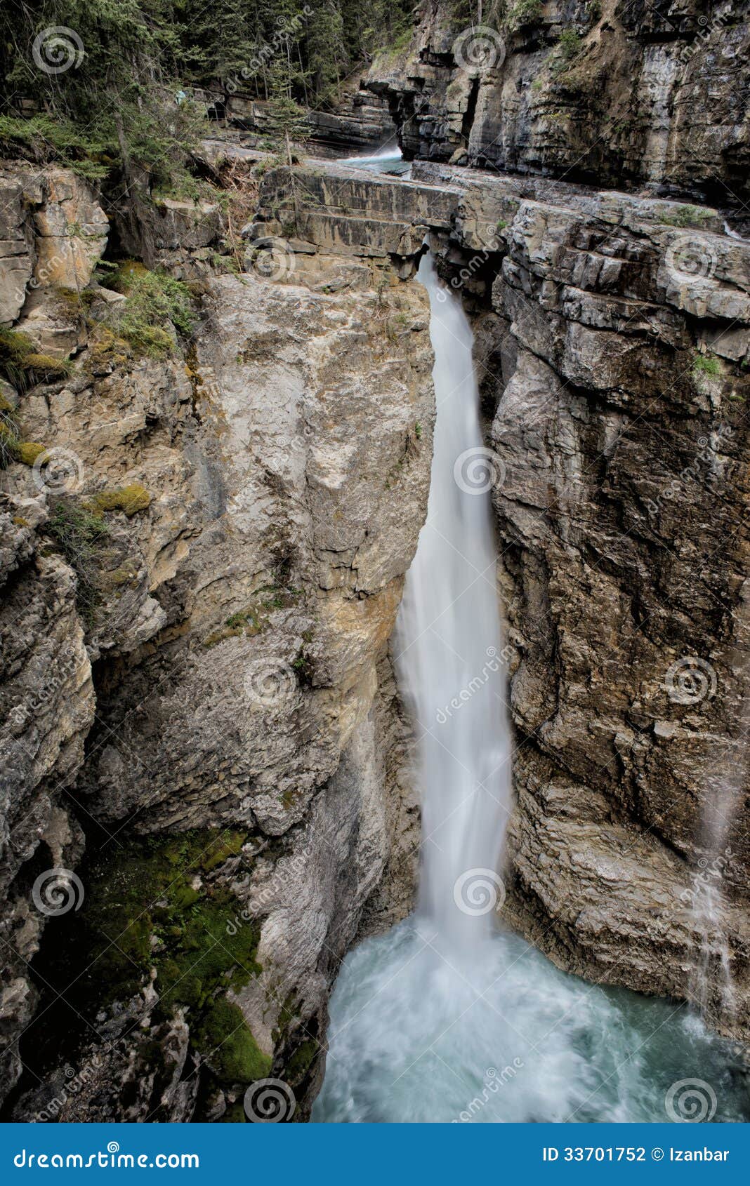 A waterFall in banff park stock photo. Image of columbia - 33701752