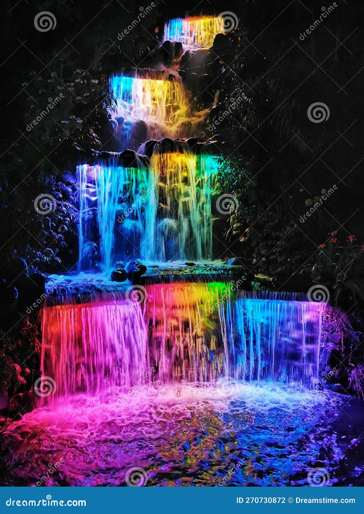 A Waterfall Cascade Lit with Bright Colours at Night Editorial ...