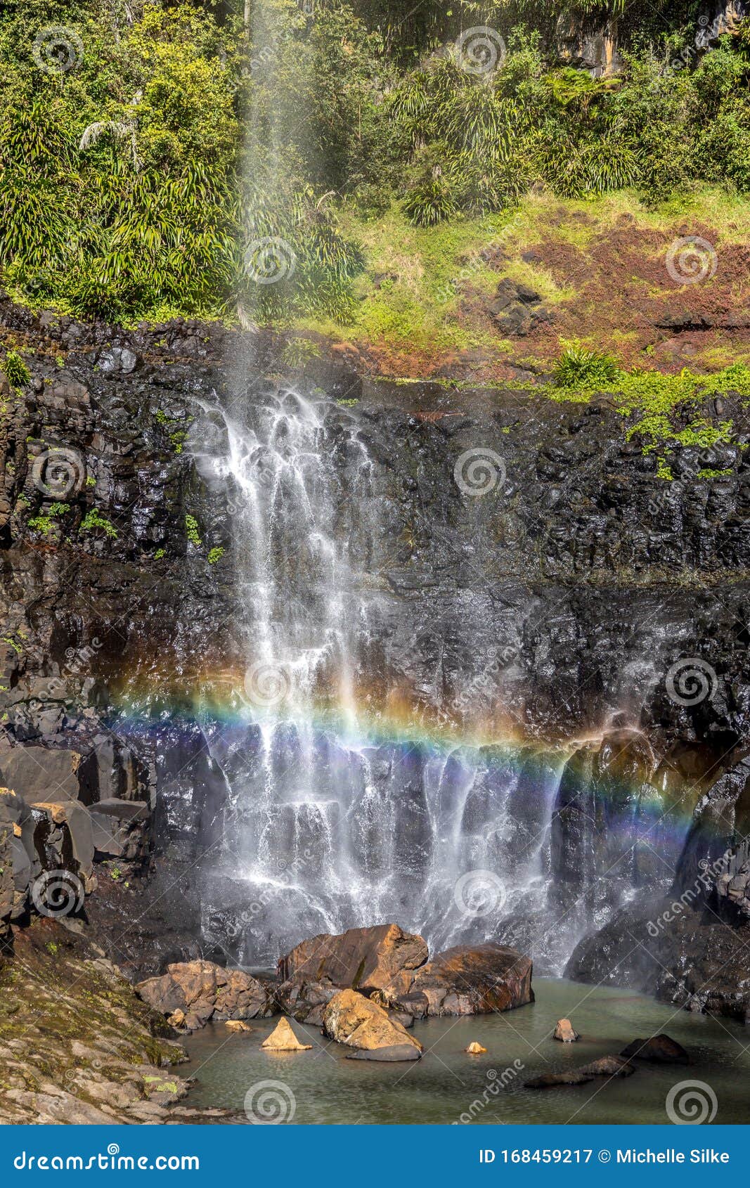 Waterfall Creating Rainbow in Rockpool Stock Image - Image of motion ...