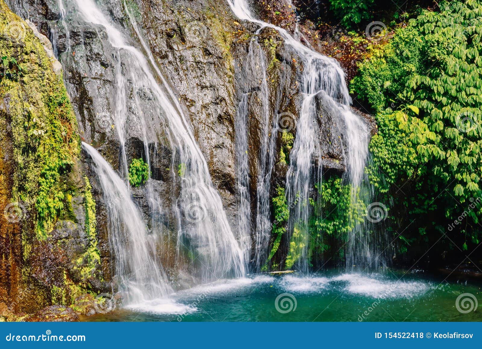 Waterfall with Crystal Blue Water and Rainbow in Tropics Stock Photo ...