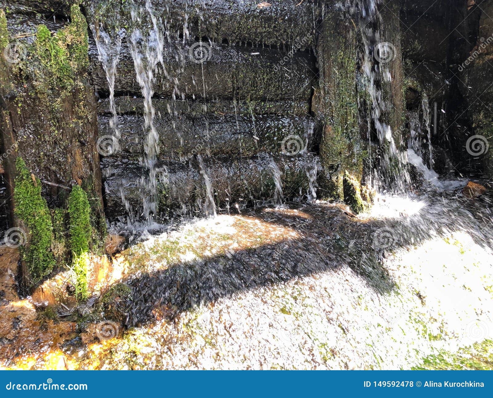 Waterfall on a Dam with Large Logs Stock Photo - Image of destination ...