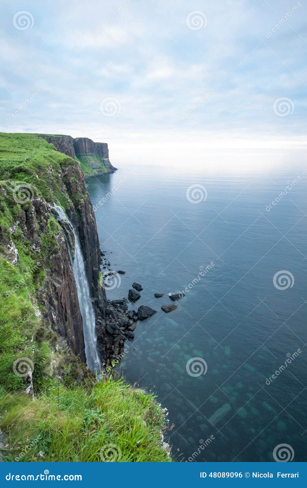 Waterfall Falling from High Cliffs into the Ocean. Stock Photo - Image ...