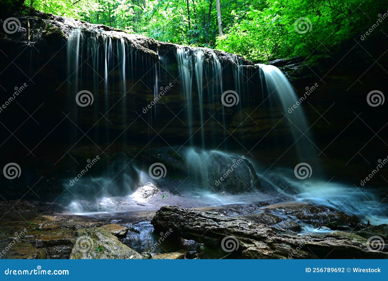 Waterfall Falling from Rocks Surrounded by Green Trees Stock Photo ...