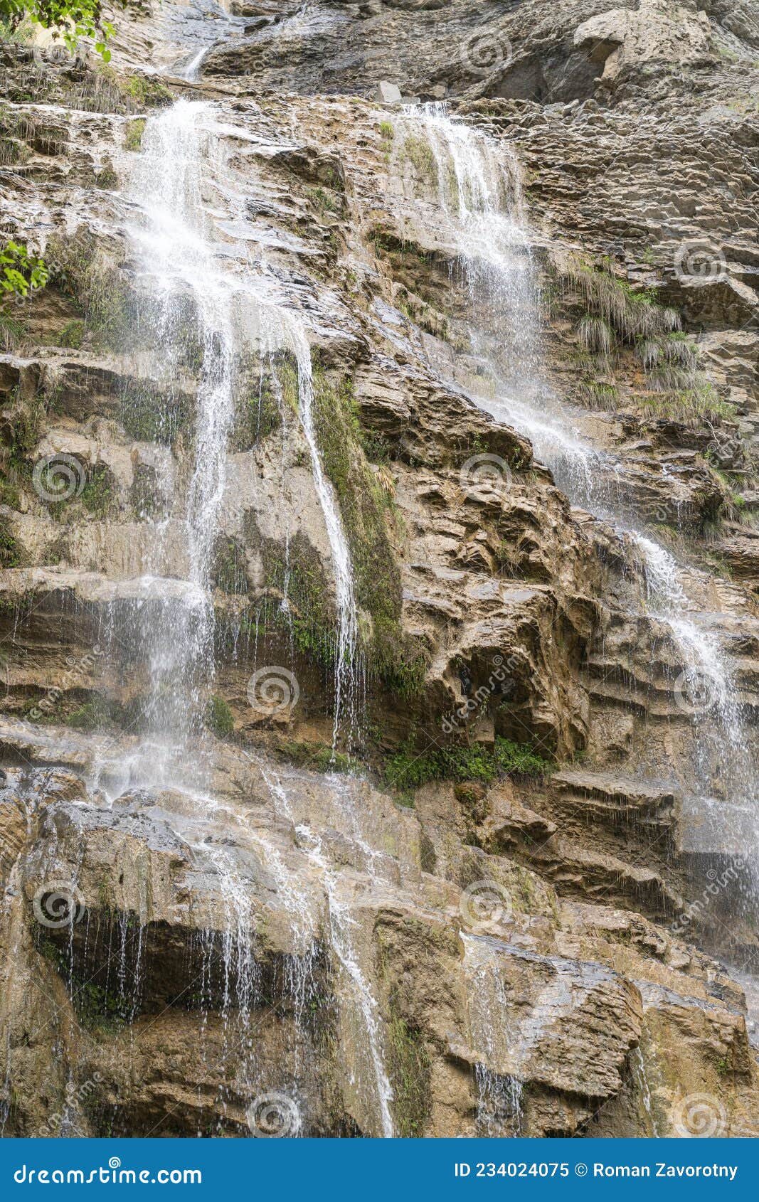 Waterfall Flowing Down from a Cliff Close-up. Vertical Photo Stock ...
