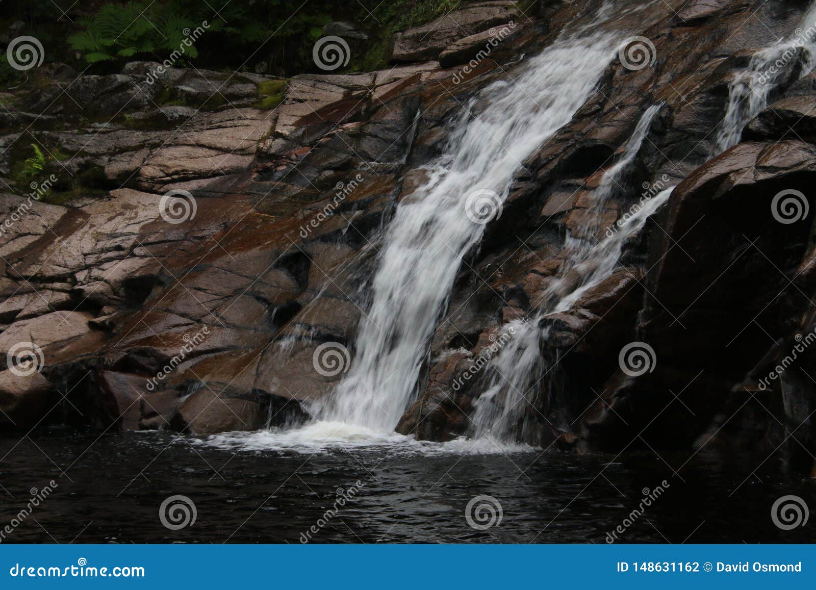 A Waterfall Flowing Down a Short Cliff Stock Photo - Image of nature ...