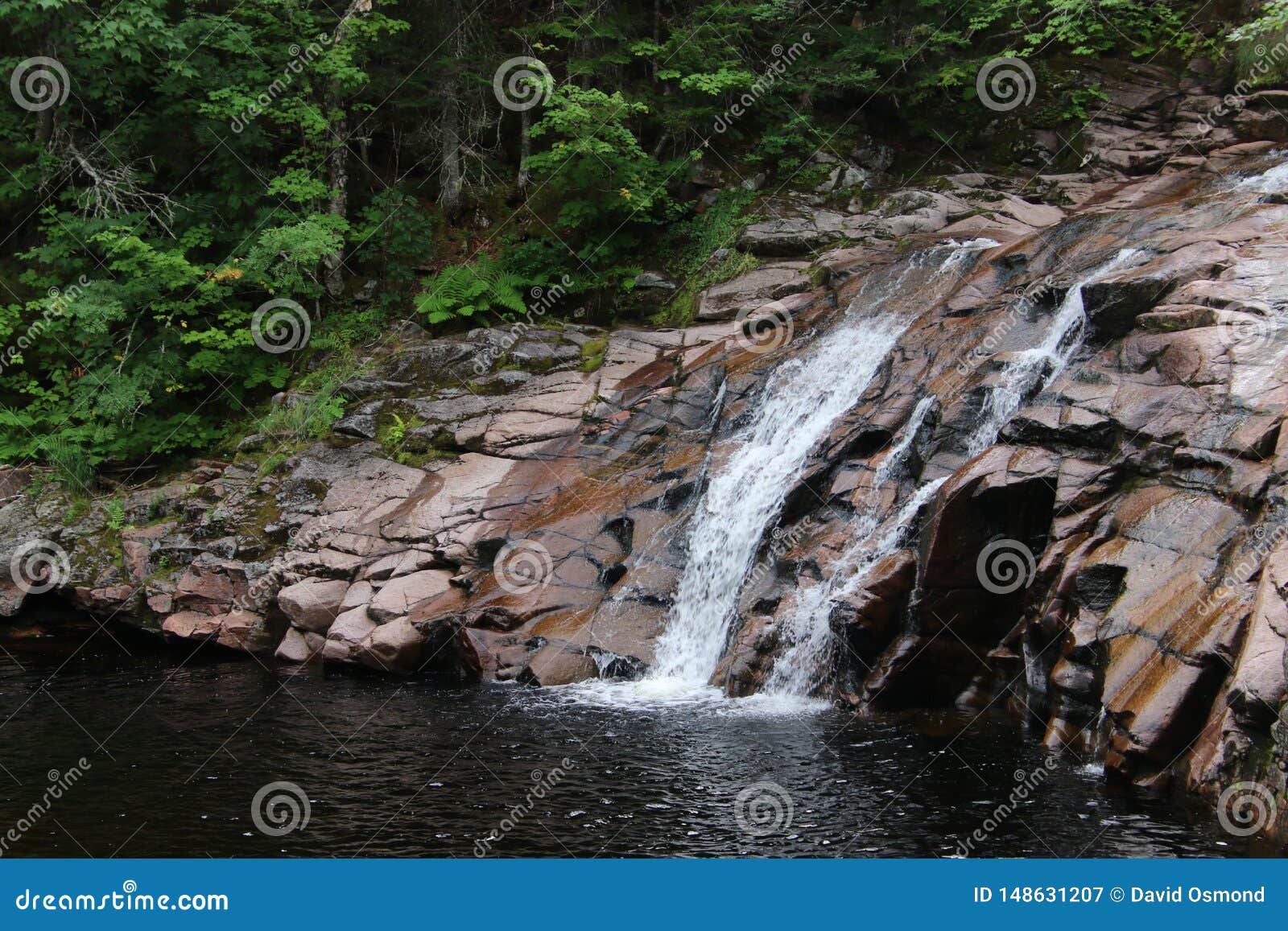 A Waterfall Flowing Down a Short Cliff Stock Image - Image of landscape ...