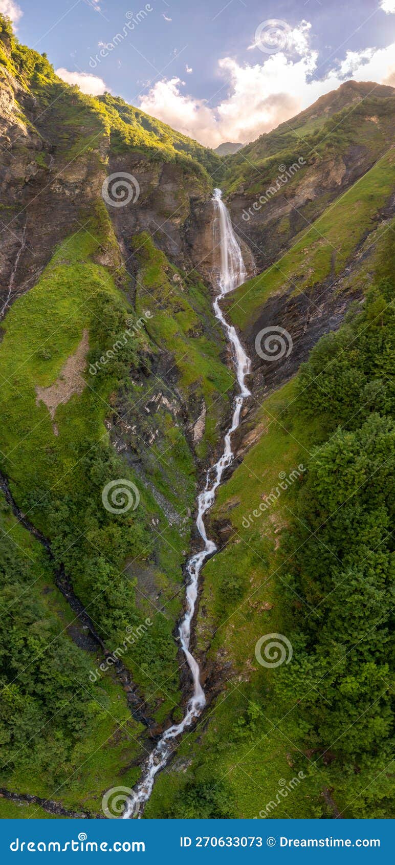 A waterfall flowing down stock image. Image of scenery - 270633073