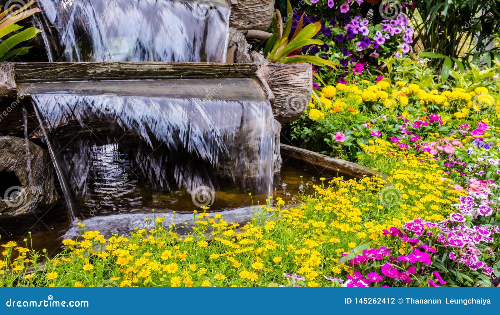 Waterfall Flows in Cozy Home Flower Garden Stock Photo - Image of grass ...
