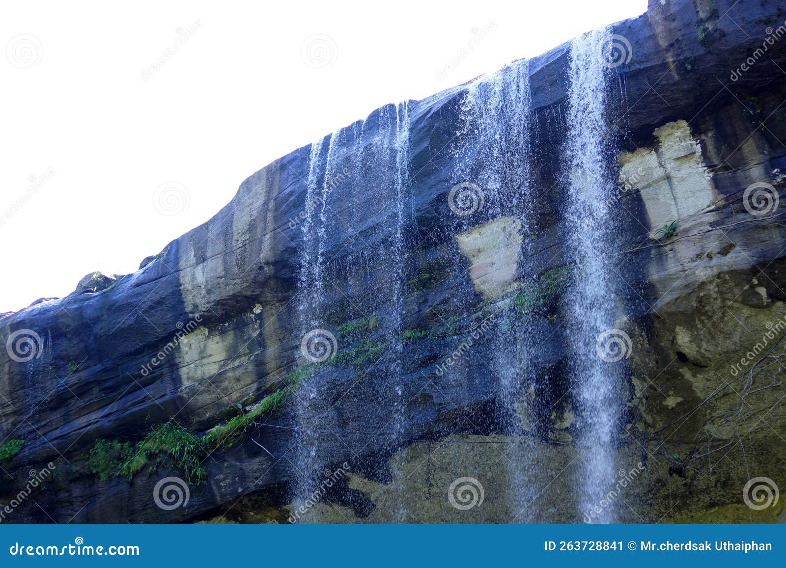 The Waterfall Flows Down from a Steep Rocky Cliff. Stock Image - Image ...