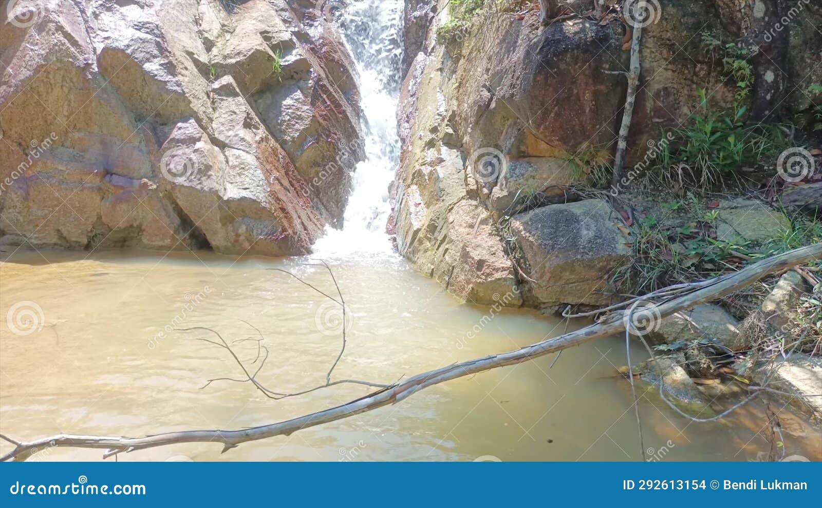 The Waterfall Flows from the Natural Rock Wall into the River Stock ...