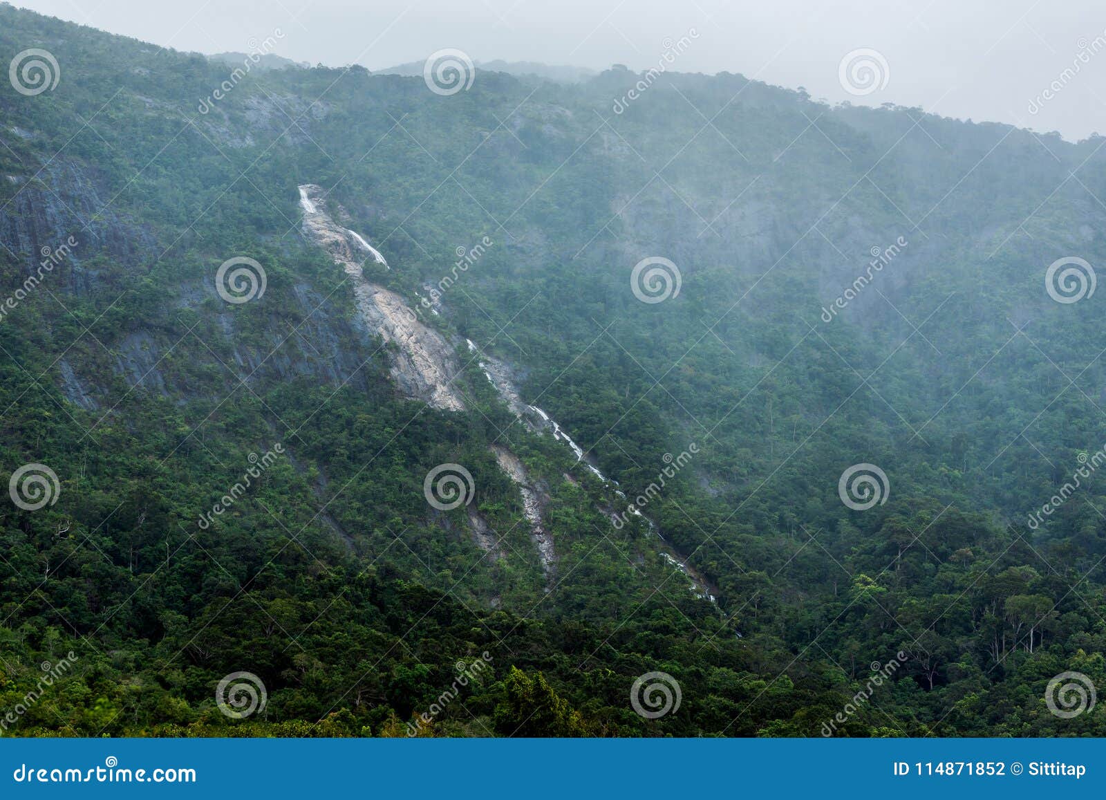 The Waterfall Flows from the Top of the Mountain Stock Photo - Image of ...