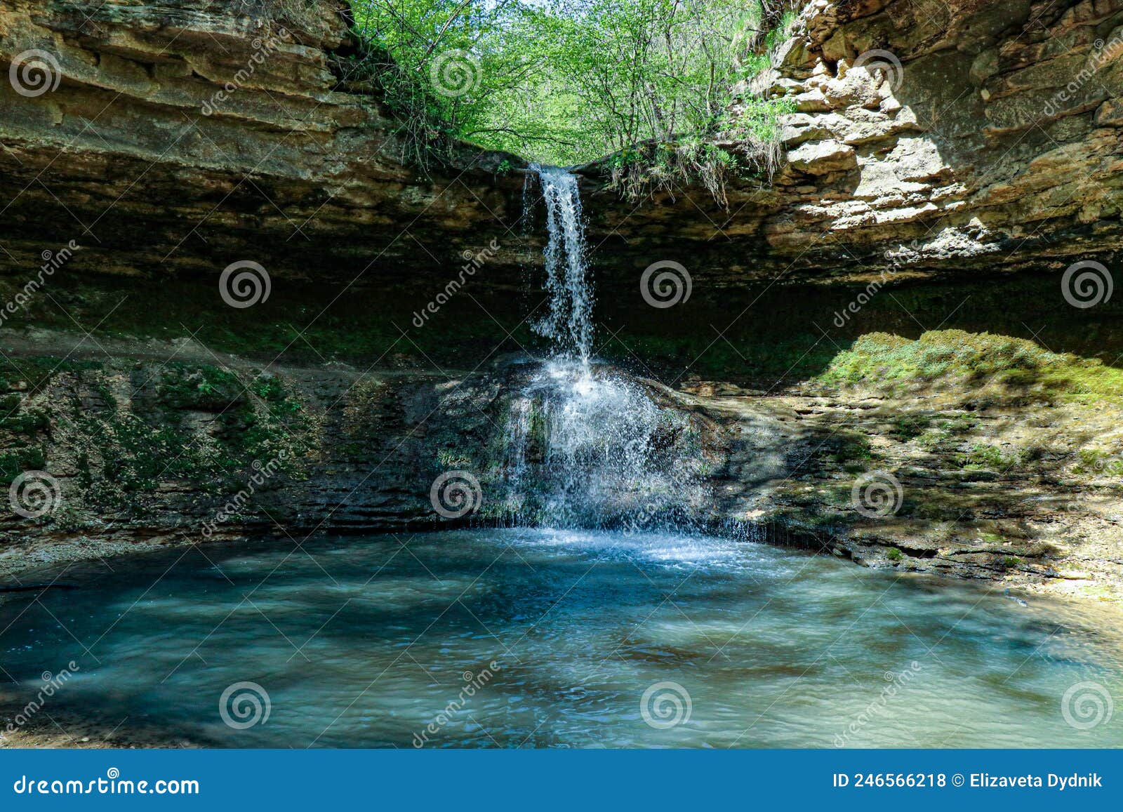 Waterfall in the Forest between the Rocks. Cold Water Flowing Down the ...