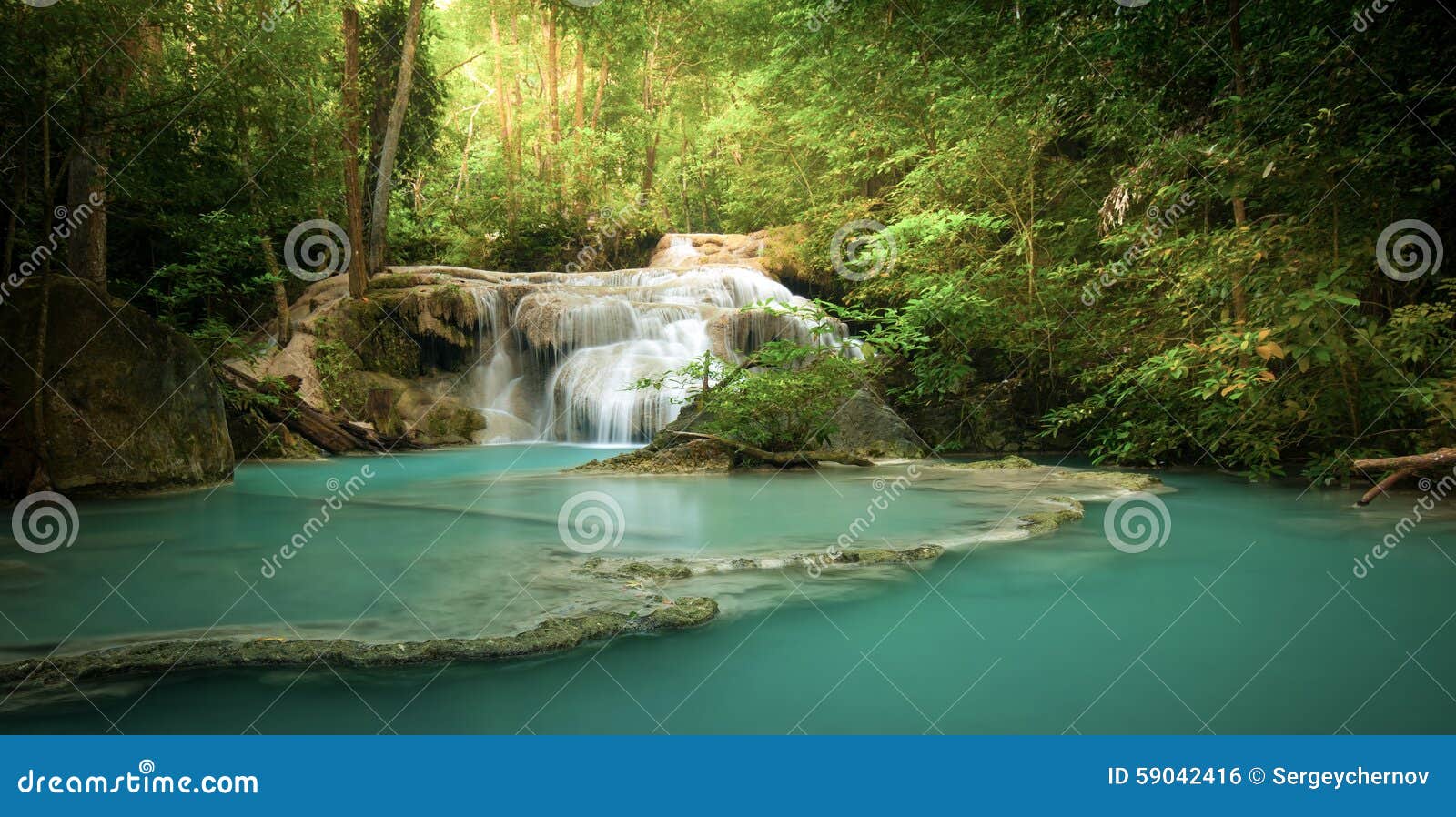 Waterfall in Forest with Sunlight Beams and Rays through Trees Stock ...