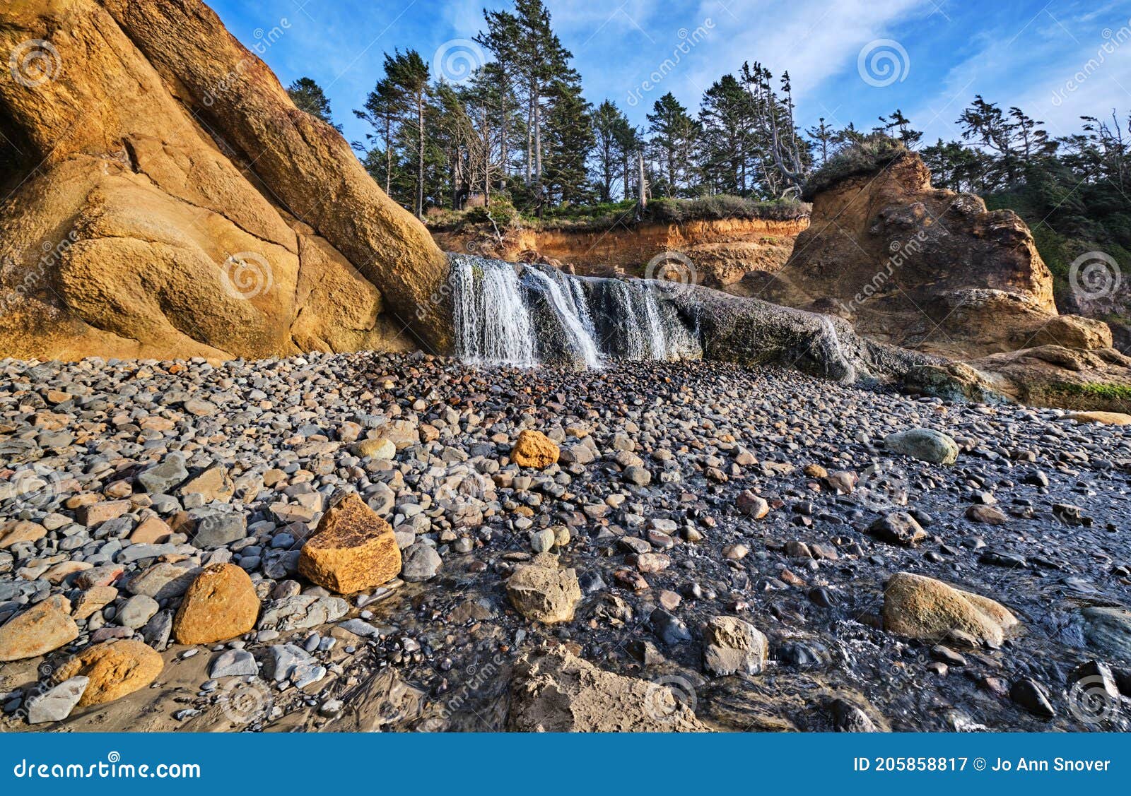 Waterfall at Hug Point stock image. Image of tide, trees - 205858817