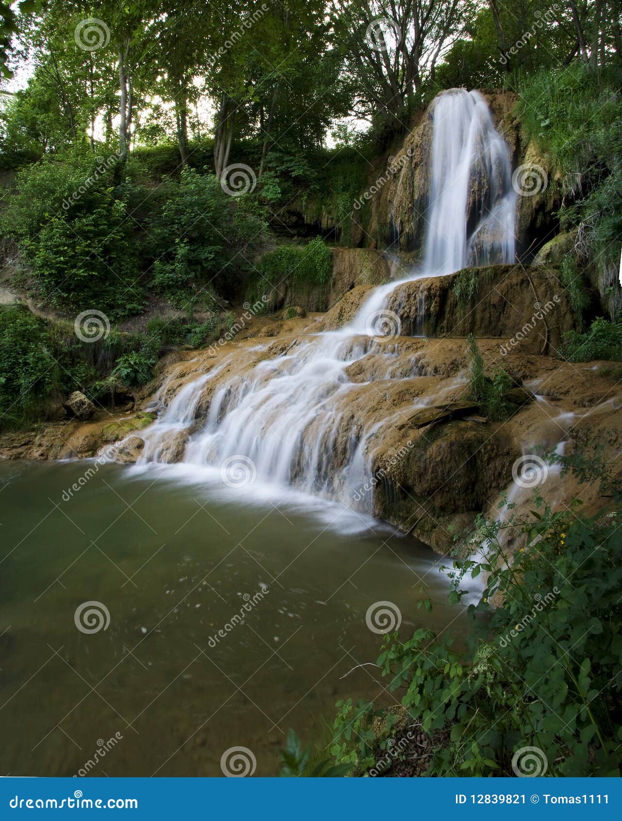 Waterfall - Lucky stock image. Image of creek, layer - 12839821