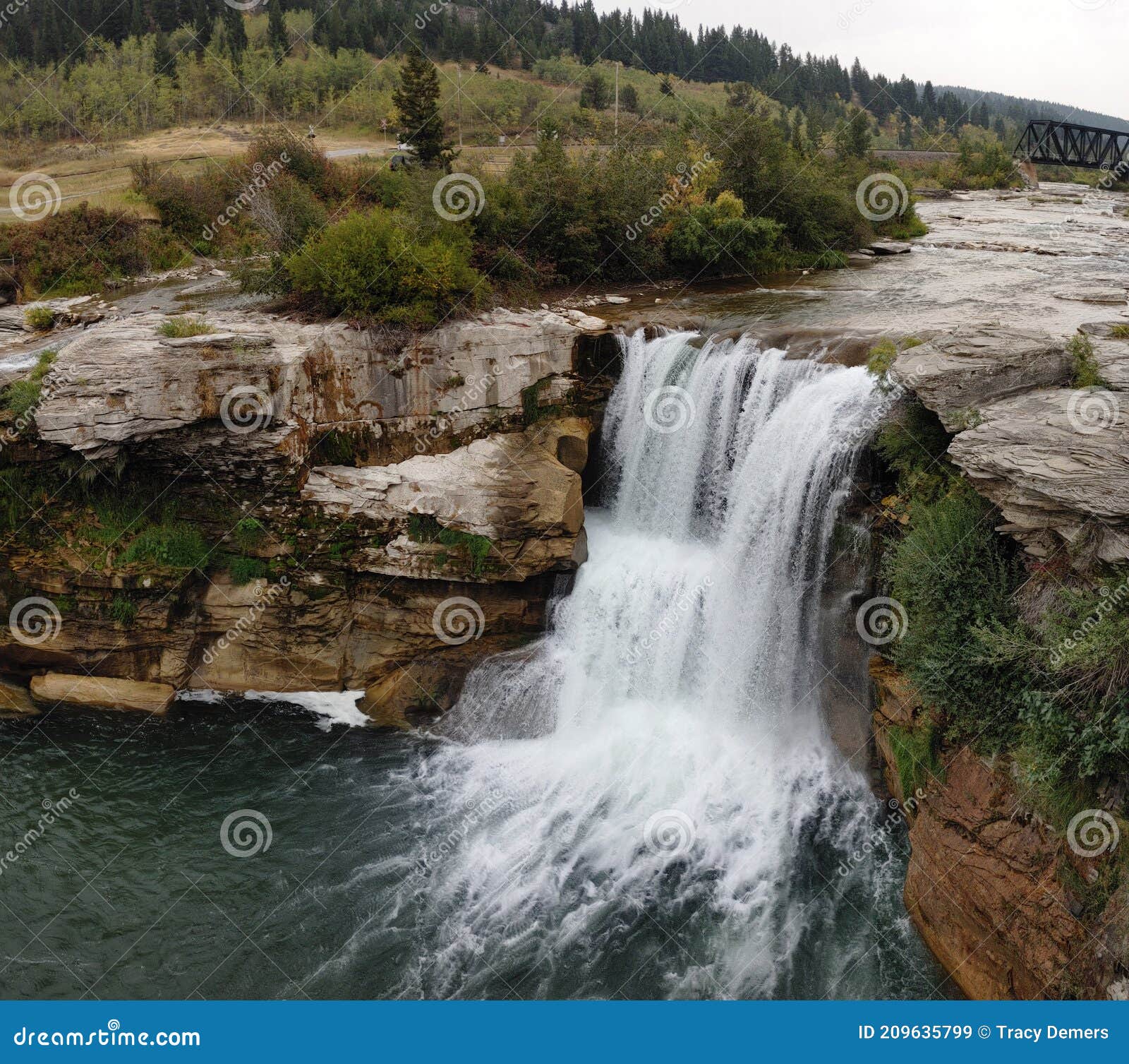 Waterfall - Old Train Bridge in Background Stock Image - Image of ...