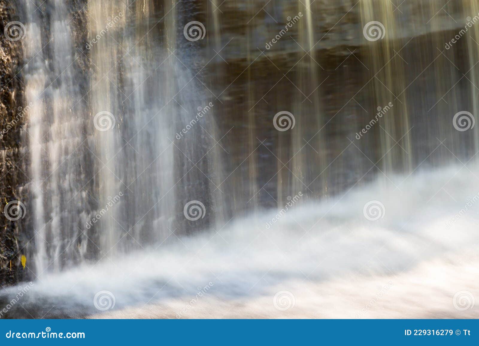 Waterfall over a dam wall stock image. Image of brook - 229316279