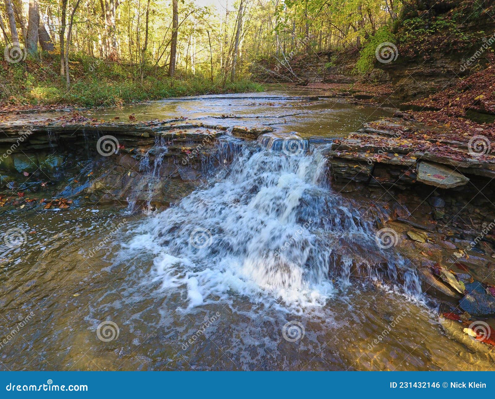 Waterfall Over Flat Rocks in Fall Forest Stock Photo - Image of creek ...