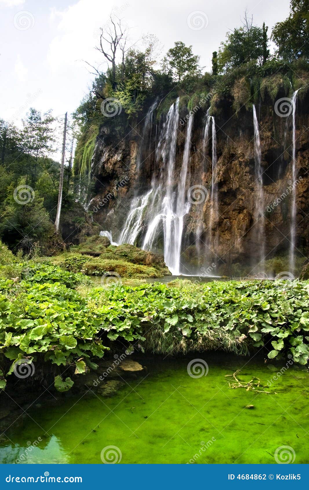 Waterfall over small lake stock photo. Image of liquid - 4684862