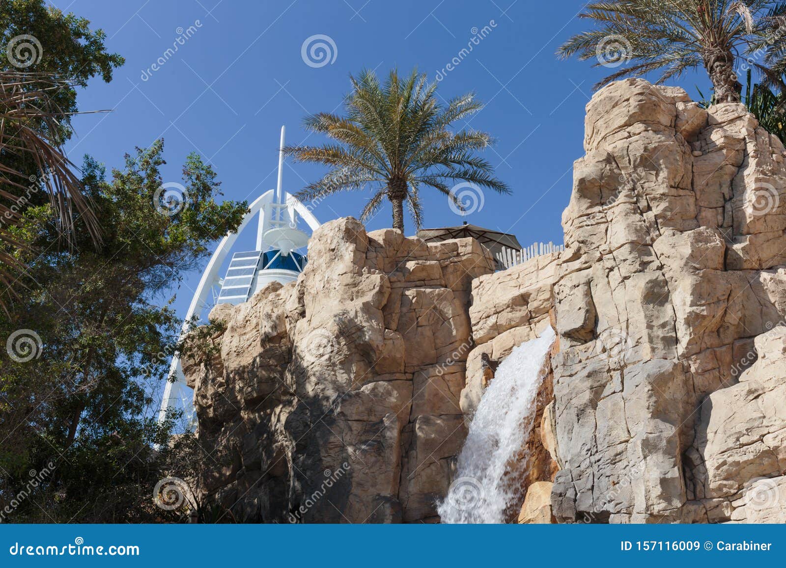 Waterfall and palm tree stock image. Image of liquid - 157116009