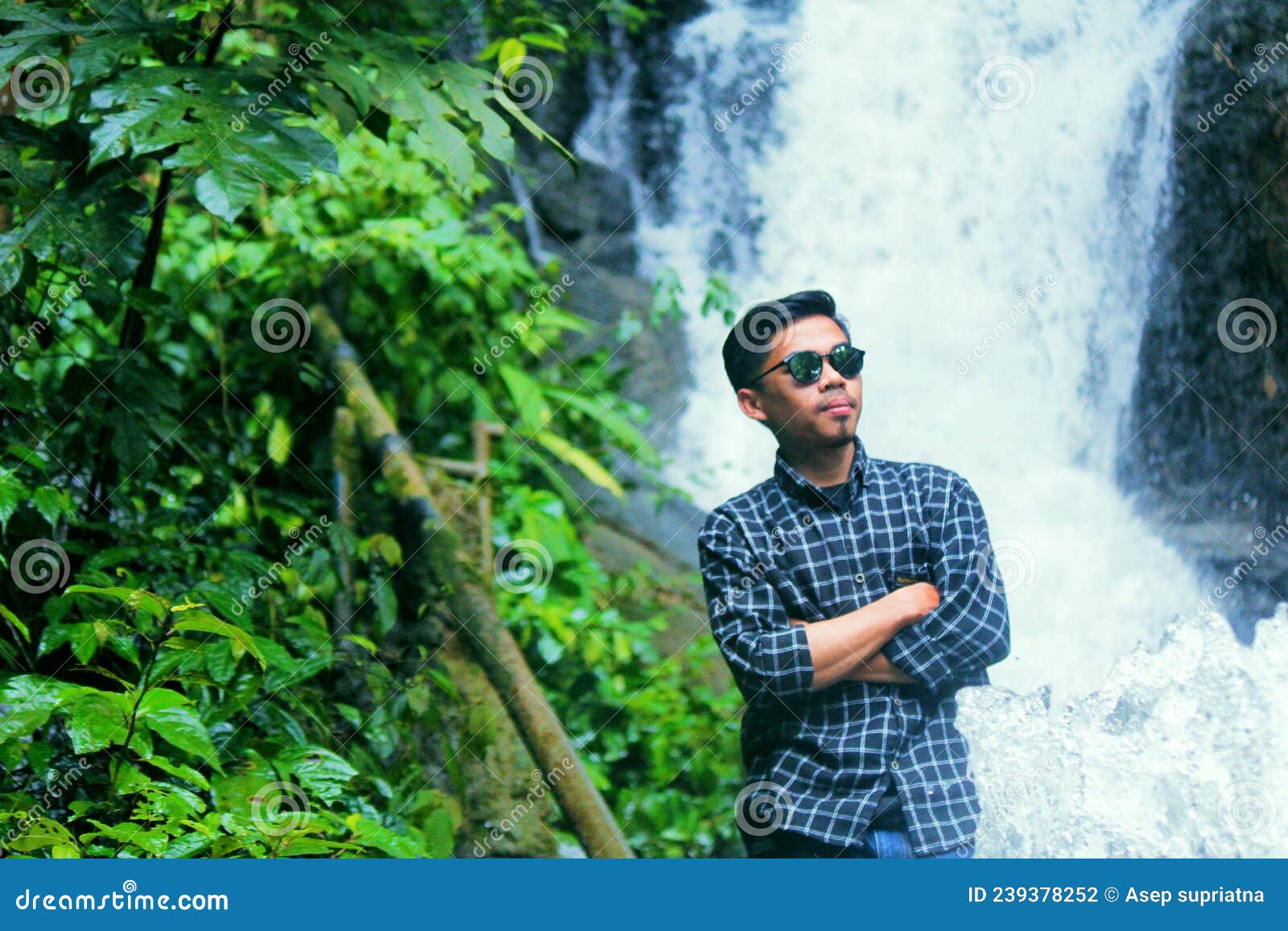 Waterfall with people stock photo. Image of natural - 239378252