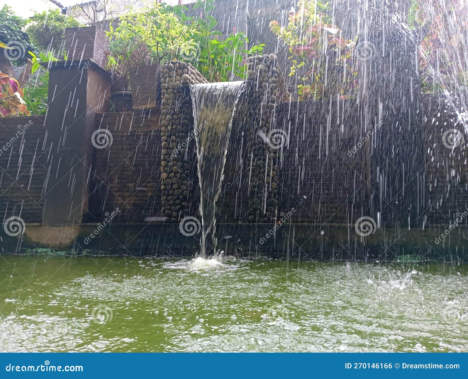 Waterfall and Rain in a Sunny Moment Stock Photo - Image of sunny ...
