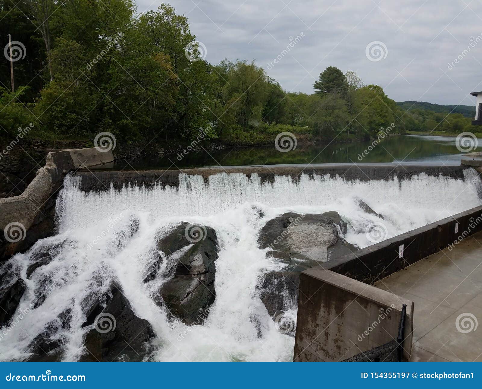 Waterfall or Rapids and Rocks and Building Stock Image - Image of ...