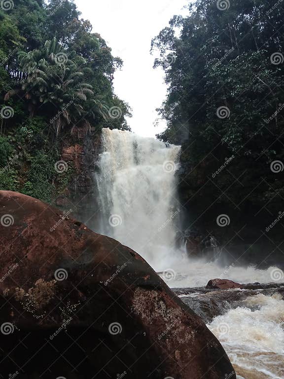 Waterfall with Red Water Color Stock Image - Image of forest, color ...