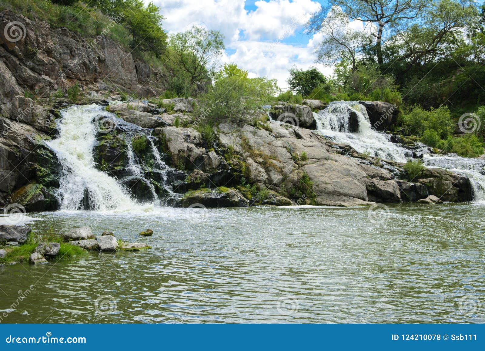 The Waterfall on the River Flows through and Over the Rocks Cove Stock ...