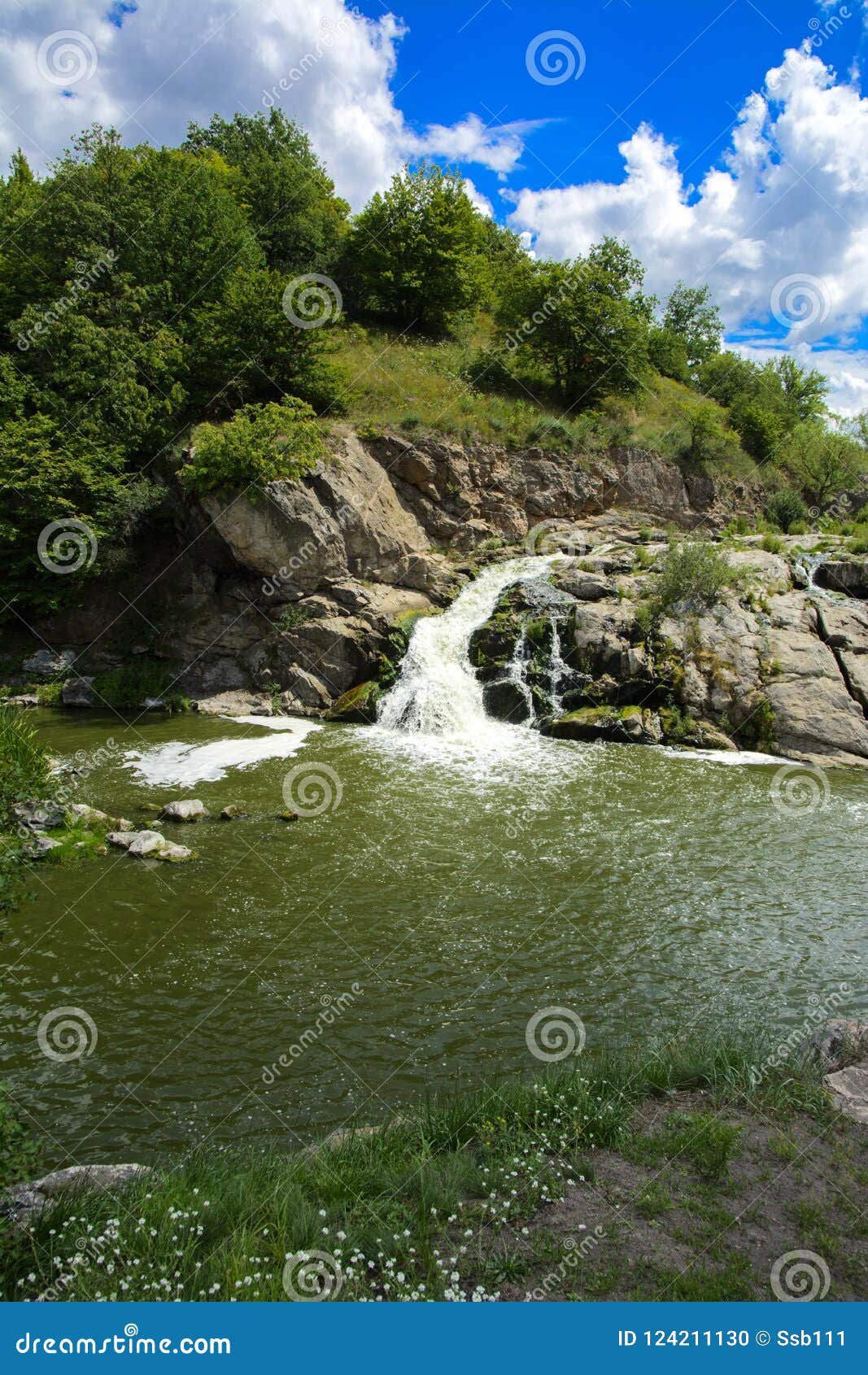 The Waterfall on the River Flows through and Over the Rocks Cove Stock ...