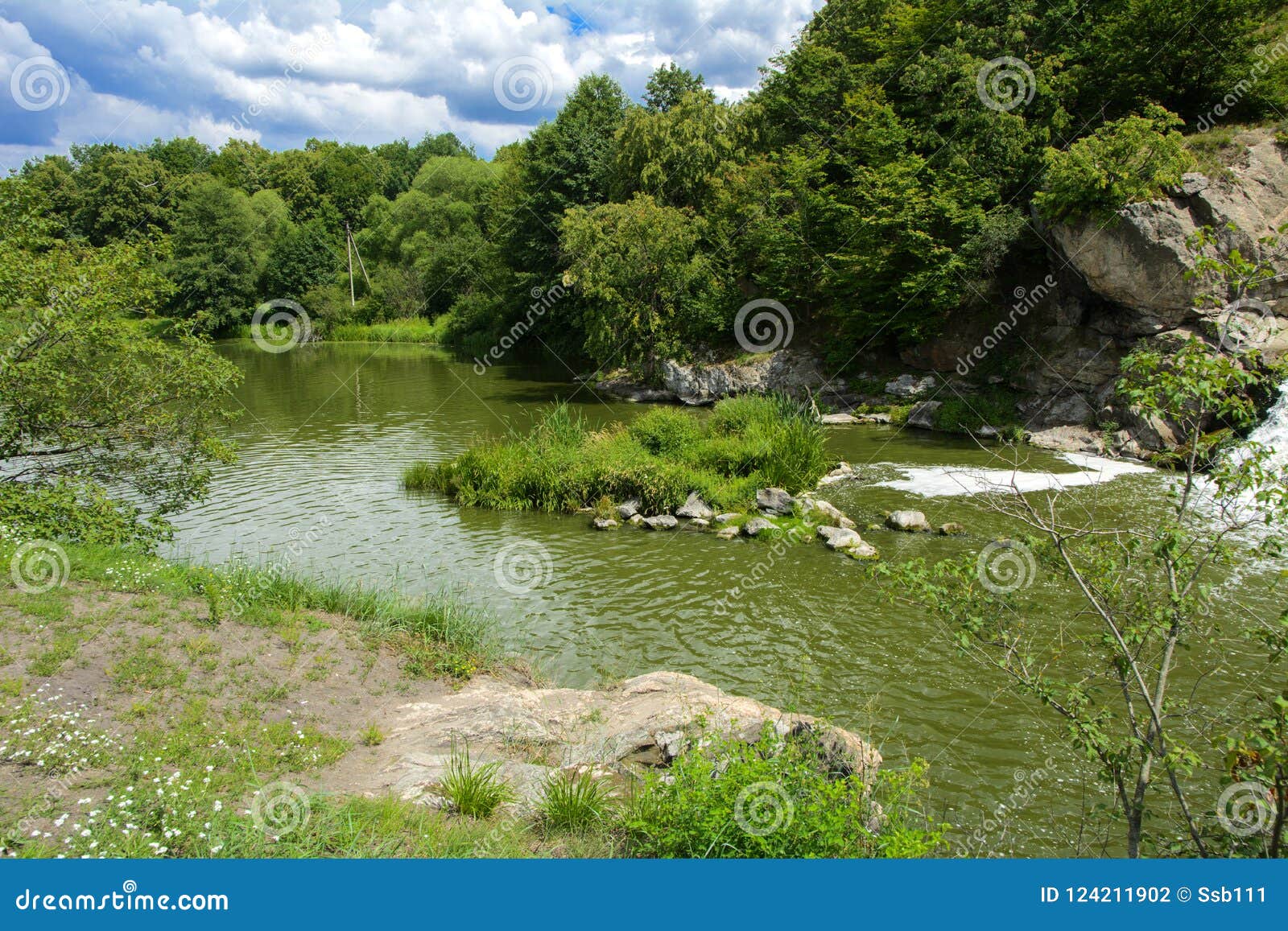 The Waterfall on the River Flows through and Over the Rocks Cove Stock ...