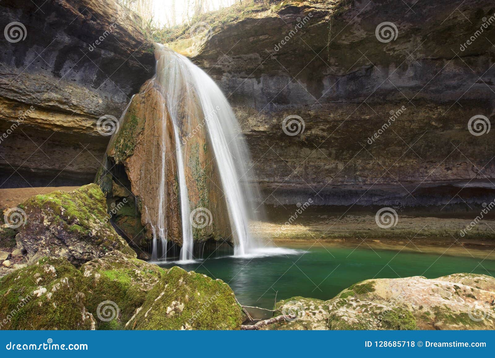 Waterfall in a rock cavity stock photo. Image of natural - 128685718