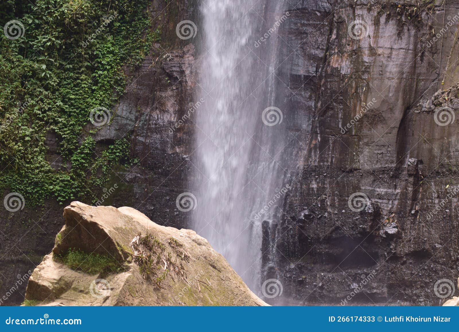 Waterfall and Rock on Jungle Java Stock Image - Image of waterfall ...