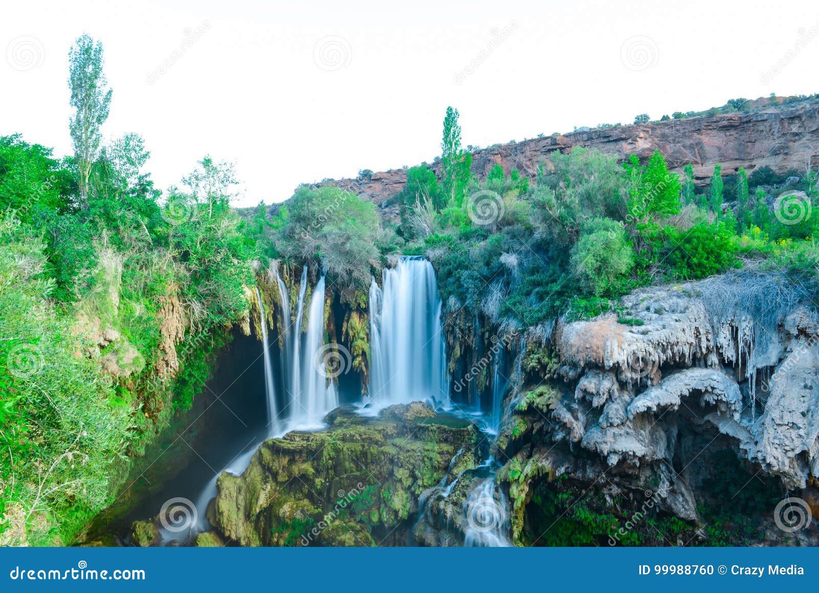 Waterfall between Rocks and Trees Stock Photo - Image of rocks, water ...