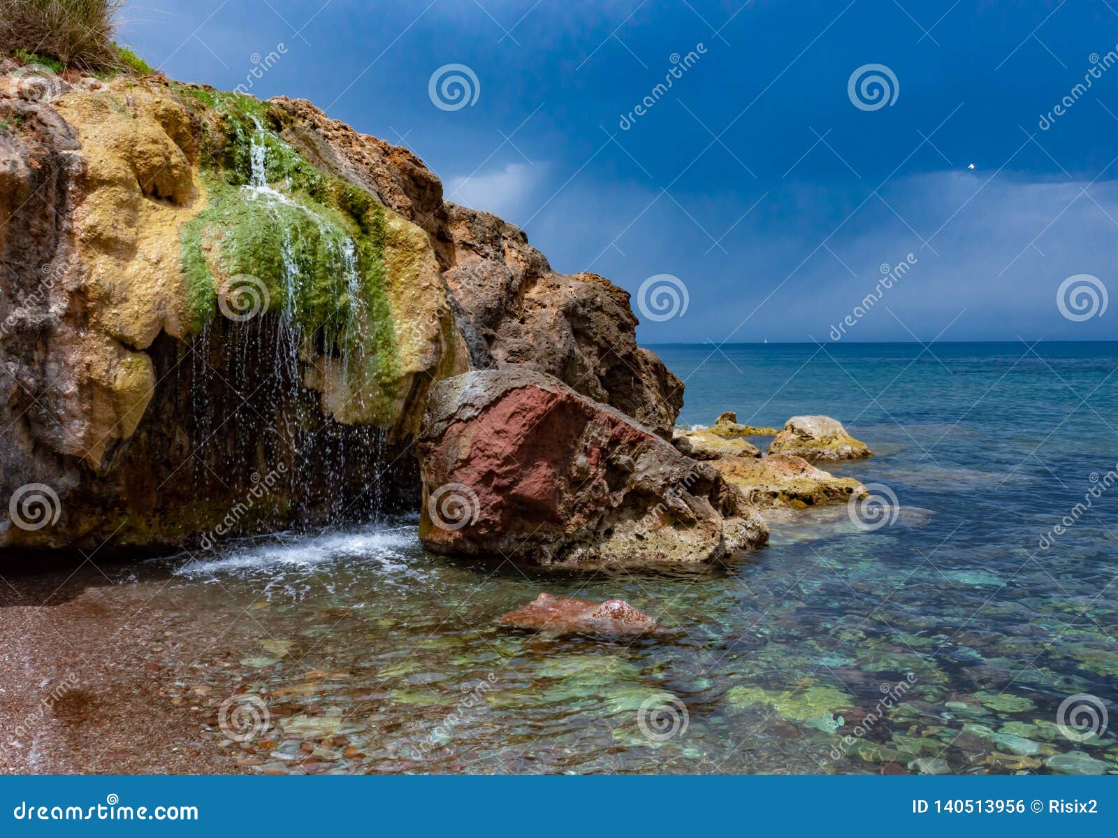 Waterfall in the Sea in Mallorca Stock Photo - Image of source ...