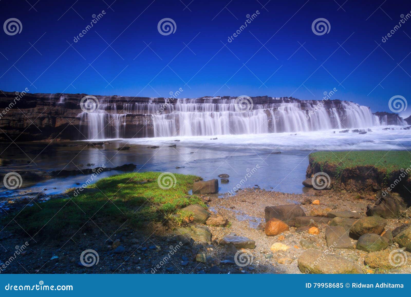 Waterfall on the sea stock image. Image of cliffs, head - 79958685