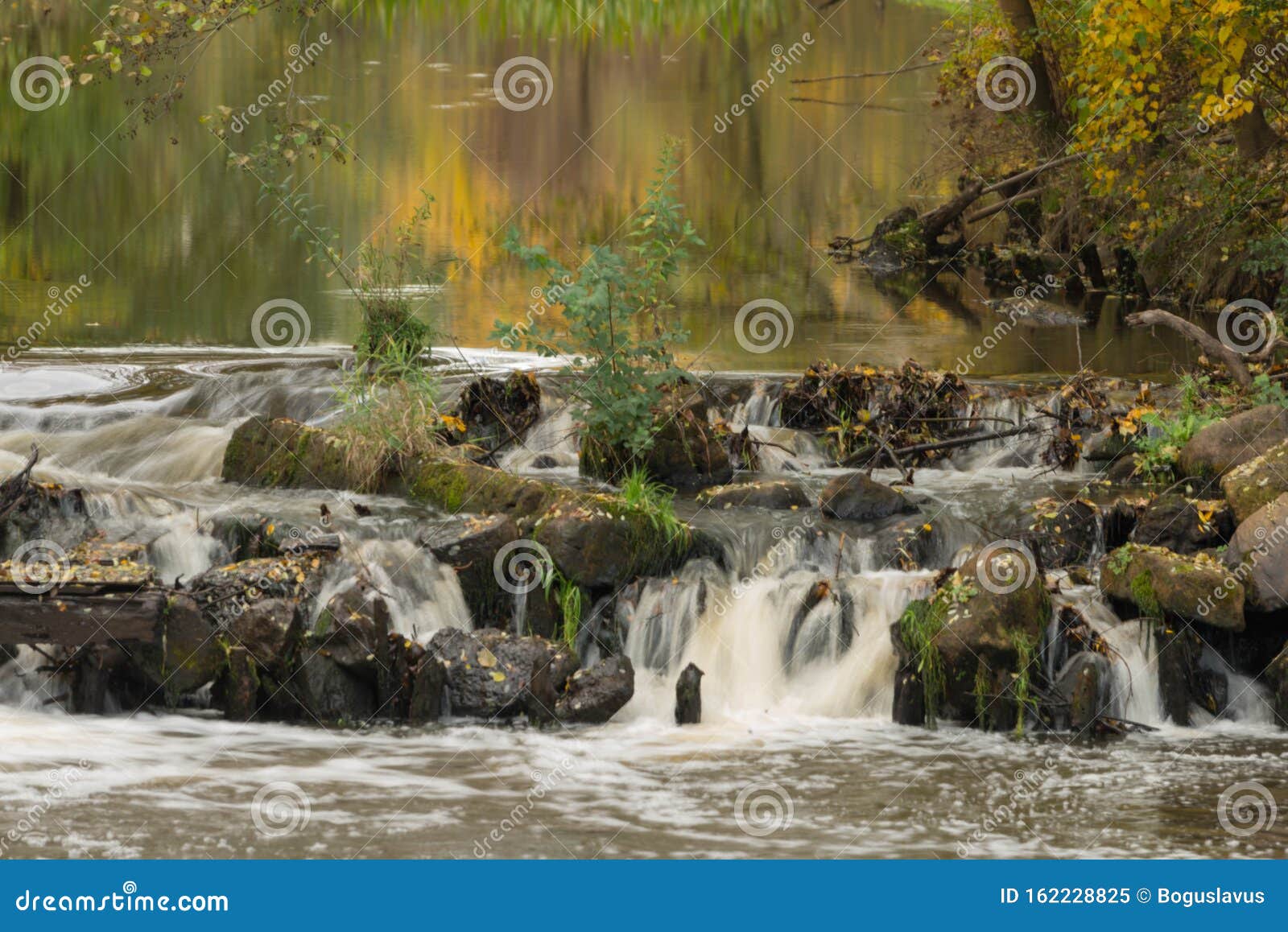 Waterfall on a Small River Flowing through the Autumn Forest. Stock ...