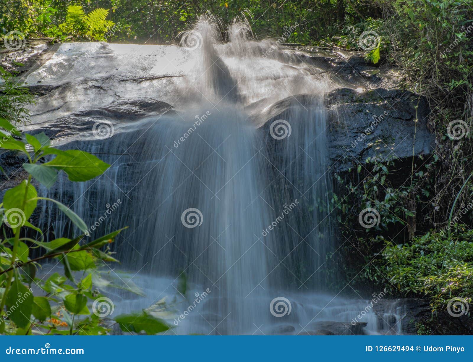 Waterfall through the Rocks Stock Photo - Image of isolated, greenery ...