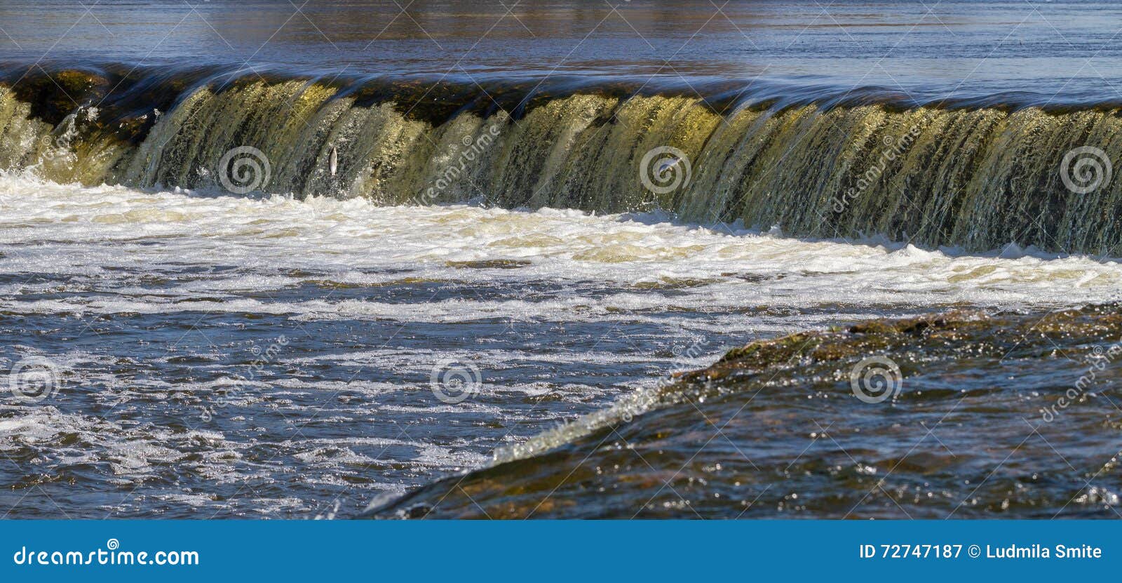 Waterfall in a spring. stock image. Image of outdoor - 72747187