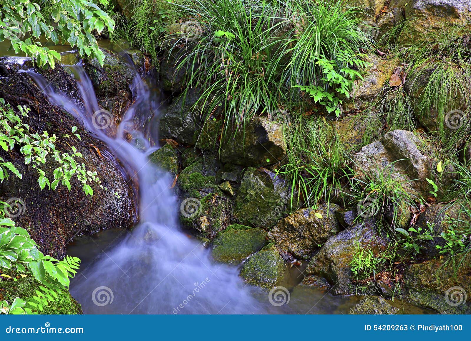 Waterfall in spring garden stock image. Image of creek - 54209263