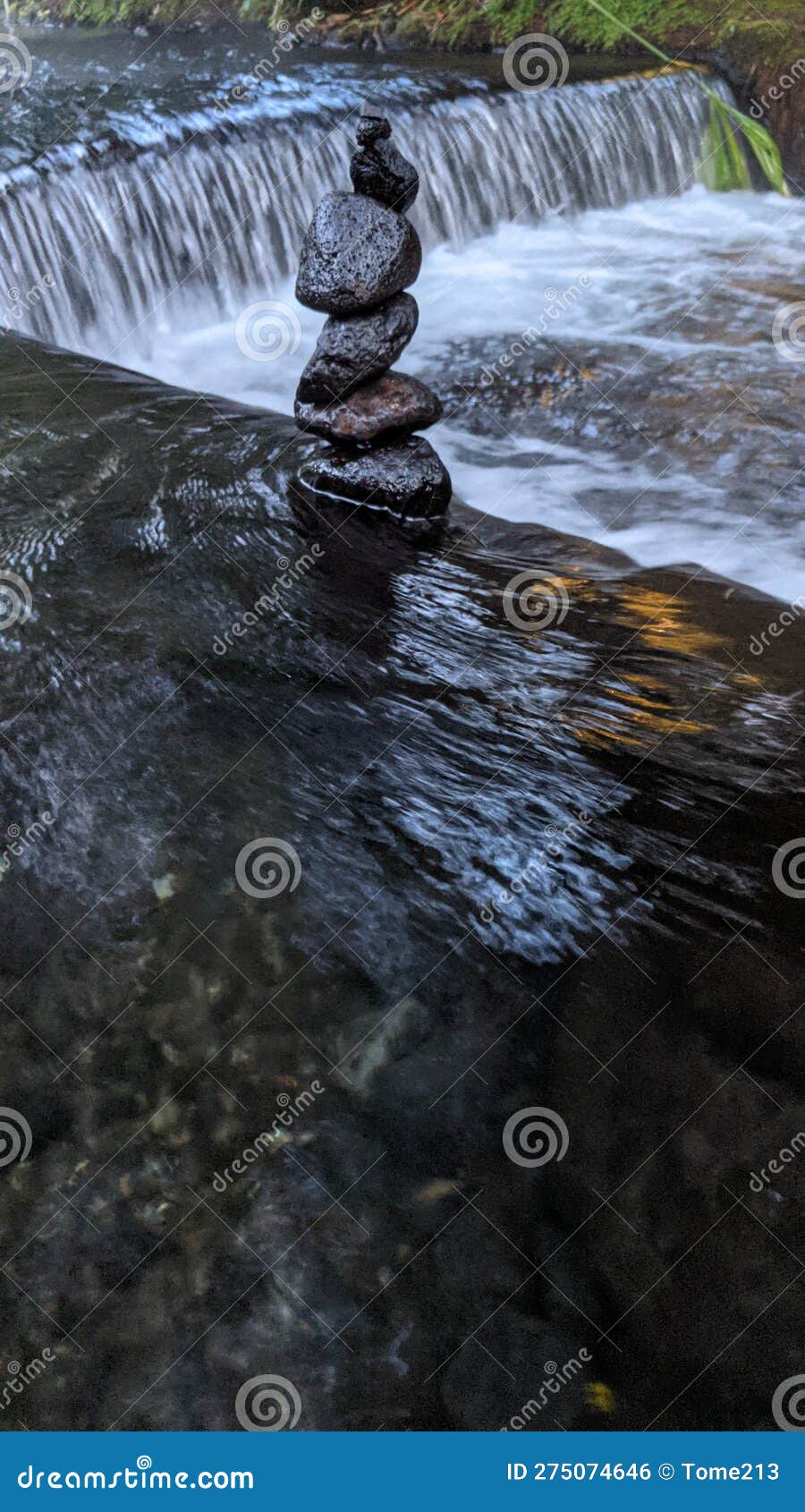 A Waterfall with a Stack of Cairn Stones Stock Photo - Image of ...