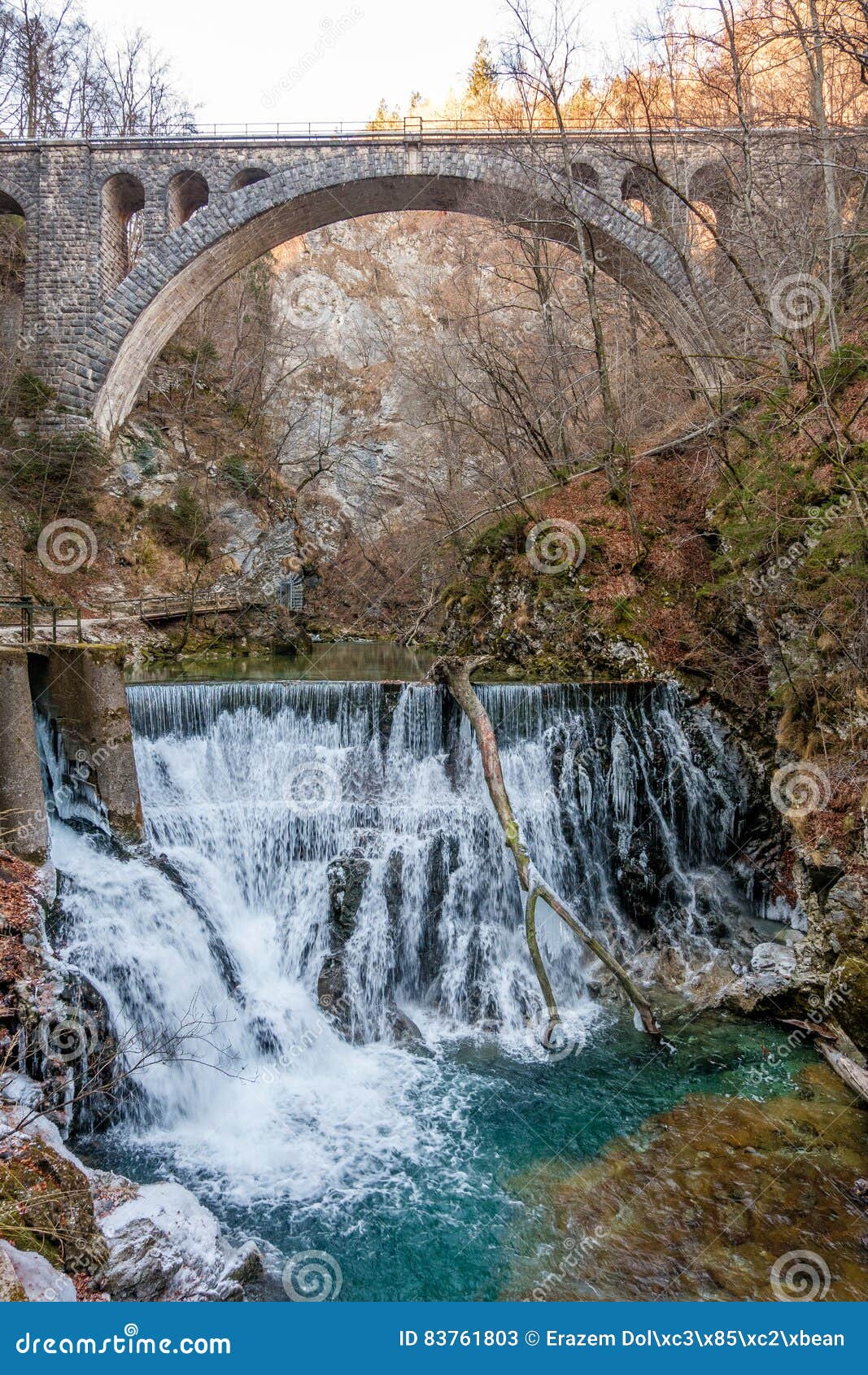Waterfall under a bridge stock image. Image of autumn - 83761803
