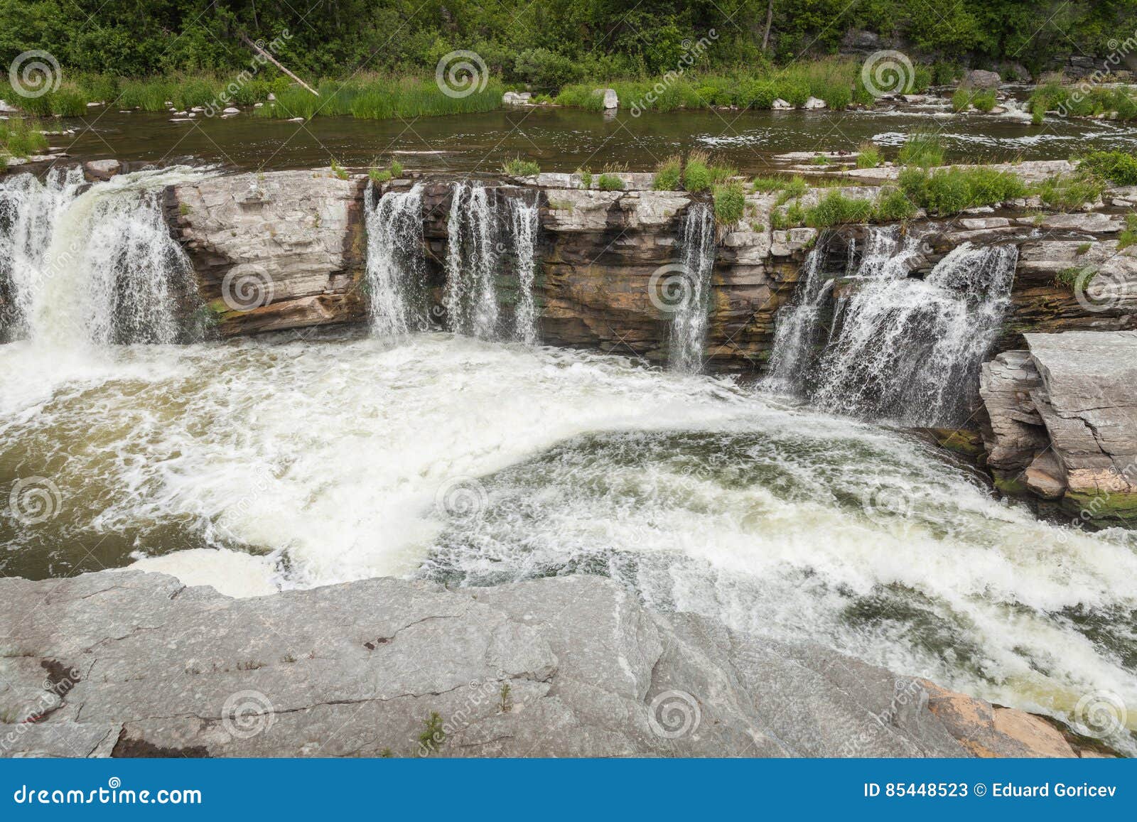 Waterfall under a bridge stock image. Image of bridge - 85448523