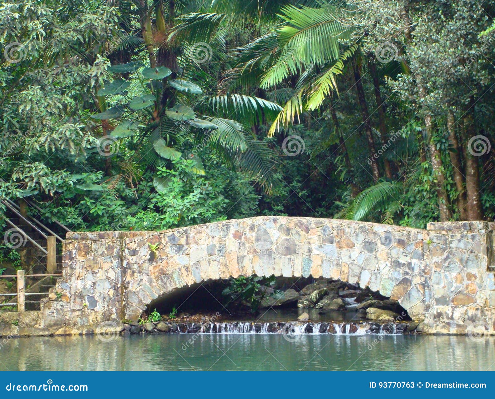 Waterfall under Bridge stock image. Image of tropical - 93770763