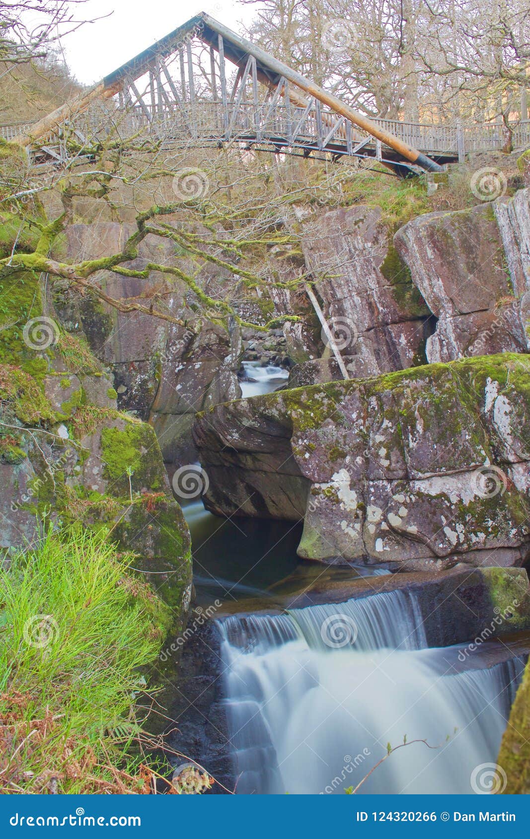 Waterfall Under Footpath Walking Bridge Running through the Woods Stock ...